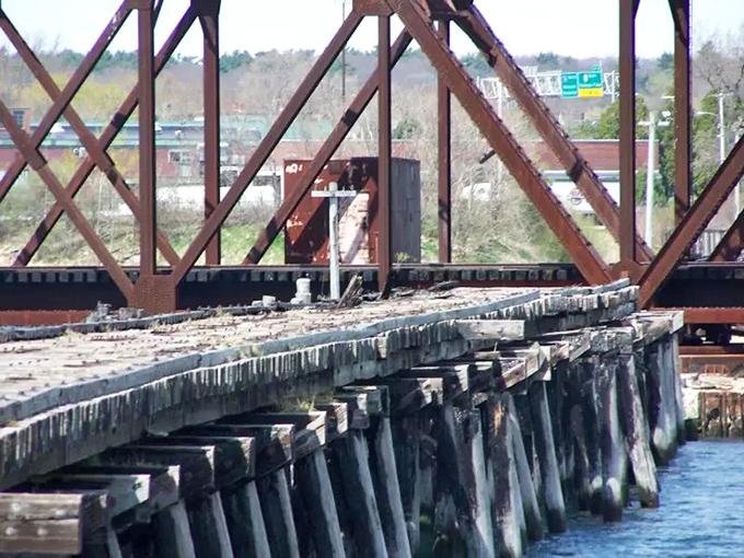 A closer inspection reveals the bridge's battle scars from decades of use, abandonment, and that fateful 1984 fire that sealed its fate.