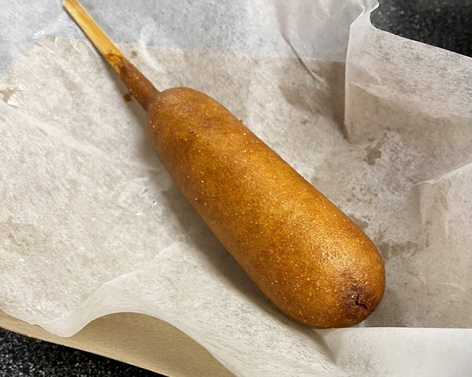 The corn dog&mdash;childhood nostalgia on a stick, golden-fried to perfection. Proof that some of life's greatest pleasures are also the simplest.
