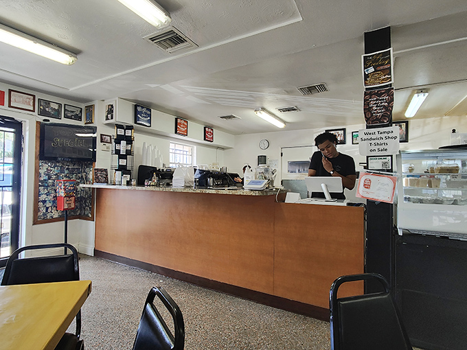 The command center where sandwich artists perform their daily ballet of assembly, pressing, and serving Cuban perfection.