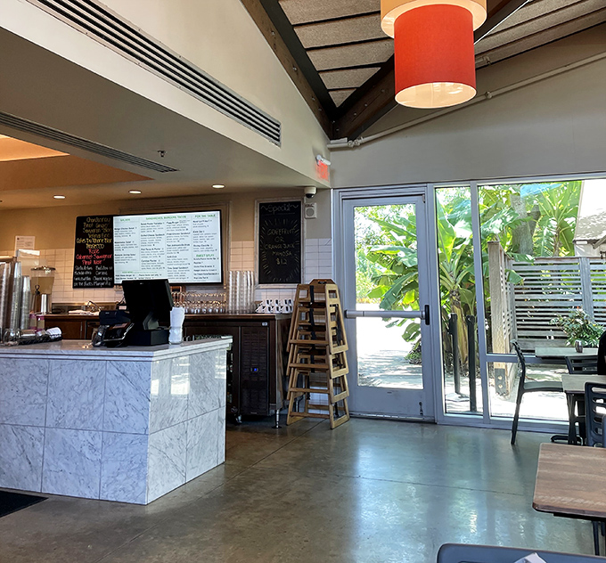 The clean, modern counter welcomes guests with efficient service and a glimpse into the kitchen where culinary magic happens.