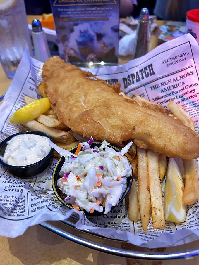 Fish and chips served on "fossil" newspaper &ndash; classic comfort food with a prehistoric twist that makes ordinary seafood extraordinary.