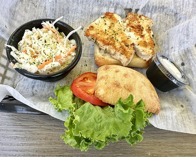The Fresh Catch Sandwich proves that sometimes the simplest approach yields the most satisfying results &ndash; just fresh fish and quality bread.