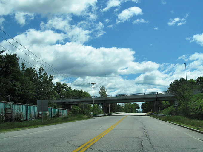 Route 26 stretches toward distant hills like an invitation to adventure, with not a single billboard to spoil the anticipation.
