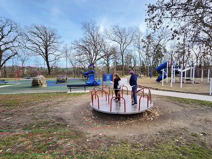 Playground equipment gives kids their own adventure space while parents recover from hiking, proving that everyone deserves their preferred entertainment style.
