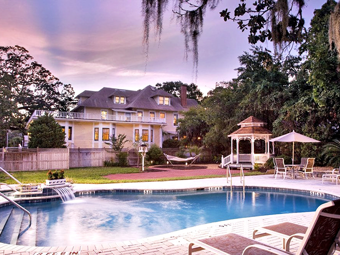 Southern leisure at its finest &ndash; a sparkling pool, inviting gazebo, and hammock create an outdoor paradise for unwinding.