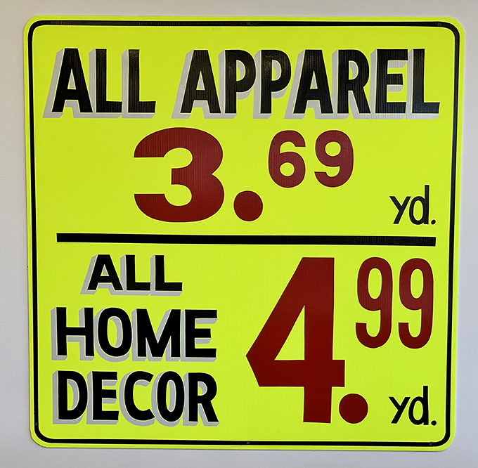The bright yellow price signs tell the unbelievable truth &ndash; quality fabrics at prices that seem transported from decades past.