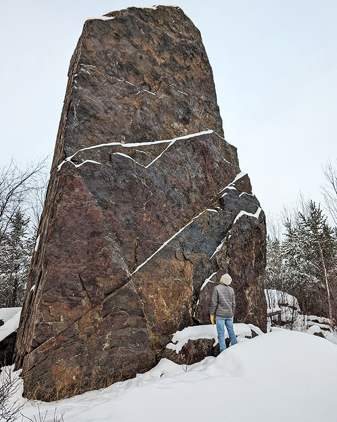 Even in winter's embrace, the magnetic monolith stands defiant against the snow, a dark exclamation point on a white page.