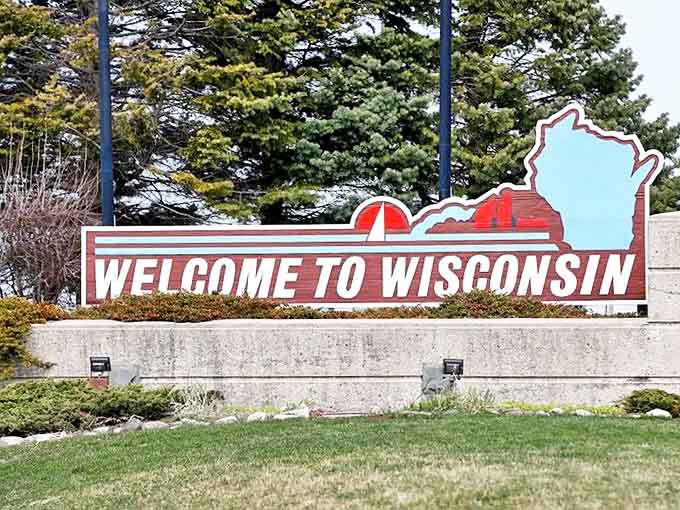 This modern welcome sign greets travelers with Wisconsin's distinctive shape, a portal to cheese curds and friendly conversations.
