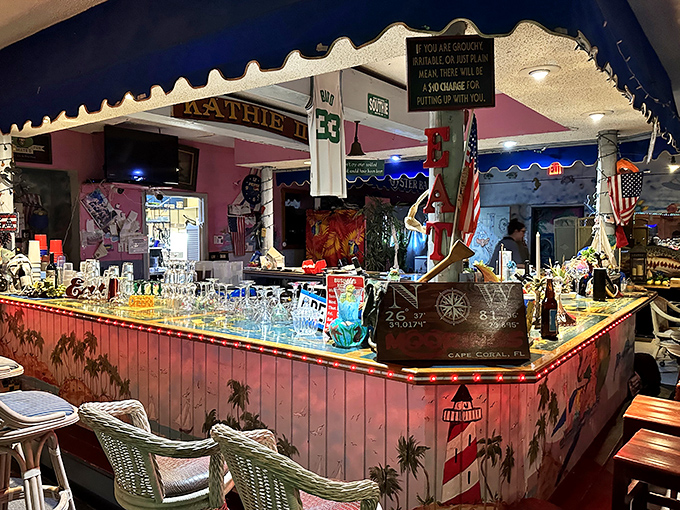 The bar area glows with warm light and coastal charm &ndash; where stories flow as freely as the drinks in this seafood sanctuary.