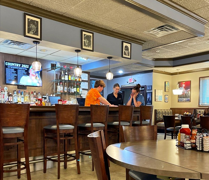 Bar area: Beatles portraits watch over patrons enjoying drinks and conversation – proof that happiness is indeed a warm pub with good company.