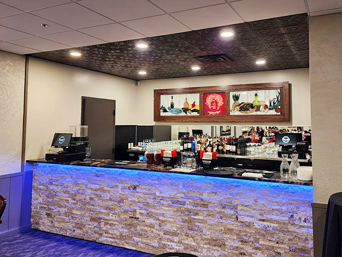 The bar area offers a cozy spot to enjoy a pre-dinner drink or catch the game while waiting for your table.