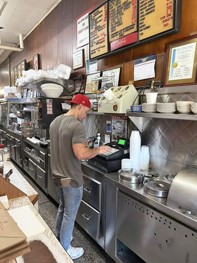 Where the magic happens&mdash;staff navigate the narrow space with practiced efficiency, a choreographed dance perfected over decades.