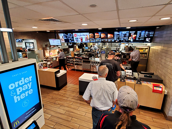Waiting in line with style: The ordering area blends modern convenience with historical charm, creating a unique fast food experience.