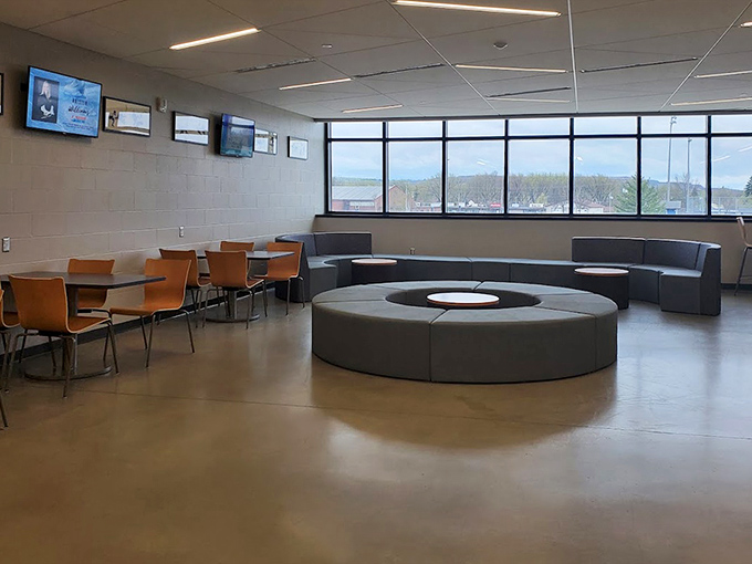 Comfortable lounge areas invite visitors to rest weary legs while watching others brave the ice through panoramic windows.