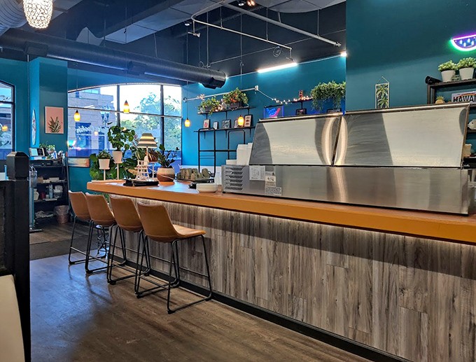 The newer location features soothing blue walls, hanging plants, and a clean wooden counter that channels modern Hawaiian caf&eacute; vibes.