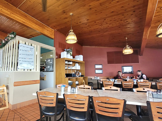 The dining area's warm tones and wooden ceiling create an atmosphere where time slows down just enough to enjoy every bite.