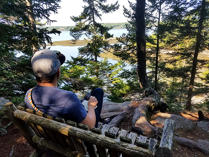 The ultimate relaxation station &ndash; weathered wood crafted into the perfect viewing perch for watching boats drift by on blue waters.