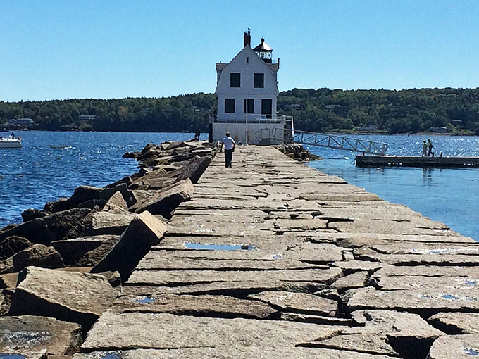 Massive granite blocks, each weighing up to 20 tons, create a remarkable pathway that has withstood over a century of ocean storms.