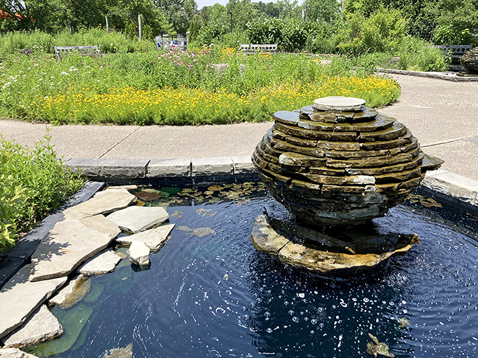 Water dances over stacked stone in this mesmerizing garden feature, where engineering and artistry create a focal point of tranquil movement.