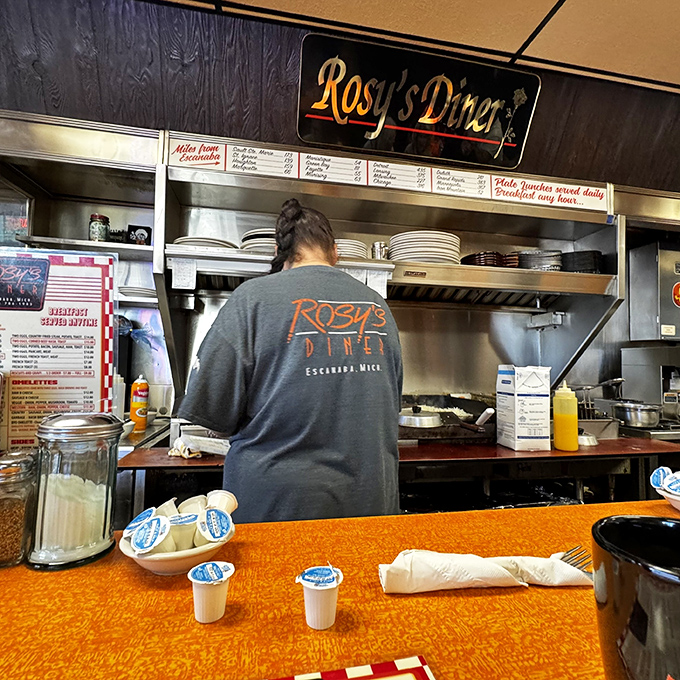 Where the magic happens—skilled hands work the grill with the casual confidence that comes only from years of flipping perfect eggs.