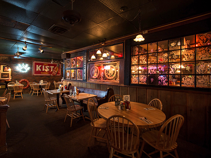 Stained glass panels filter light across wooden tables where countless meals have turned strangers into friends.