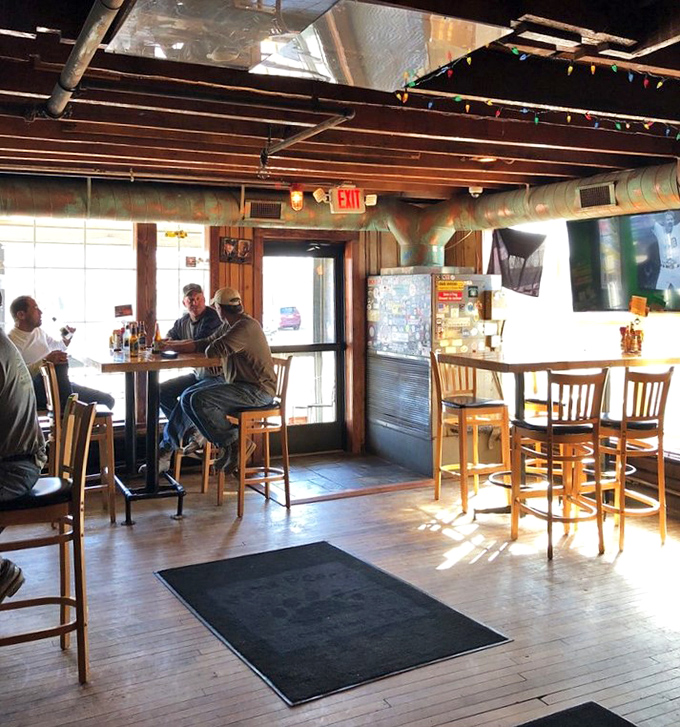 Sunlight streams through windows that have witnessed nearly two centuries of Michigan history, illuminating today's burger enthusiasts.