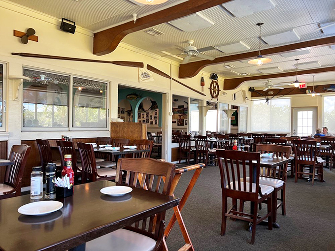 Another interior angle: Wooden chairs await hungry adventurers in this bright, airy space where island time is the only time that matters.