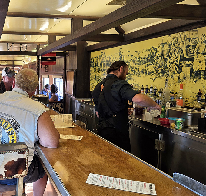 The bartender crafts liquid memories in this rolling speakeasy, where every cocktail comes with a side of nostalgia.