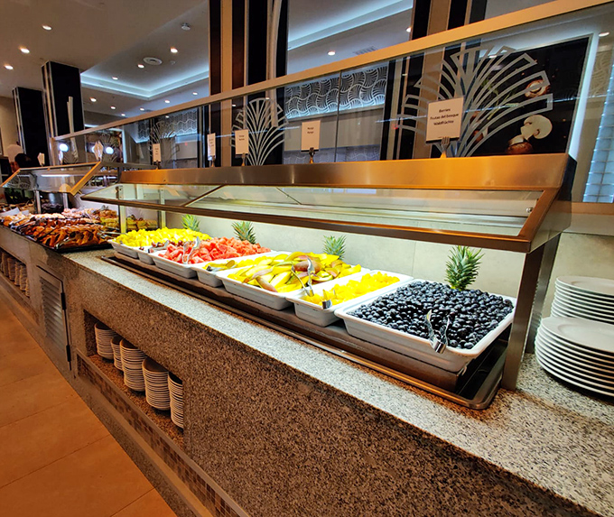 The buffet stations gleam like the pearly gates to food heaven, where calories don't count and elastic waistbands are always in fashion.