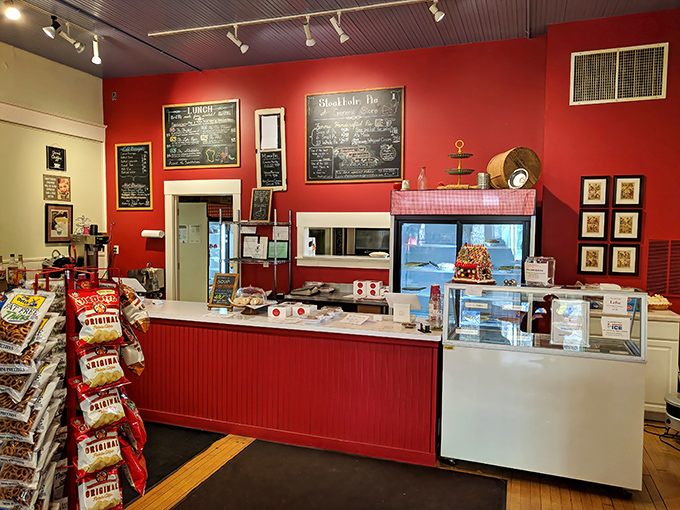 The red counter area serves as command central for pie distribution and coffee creation &ndash; a stage where culinary dreams come true one slice at a time.
