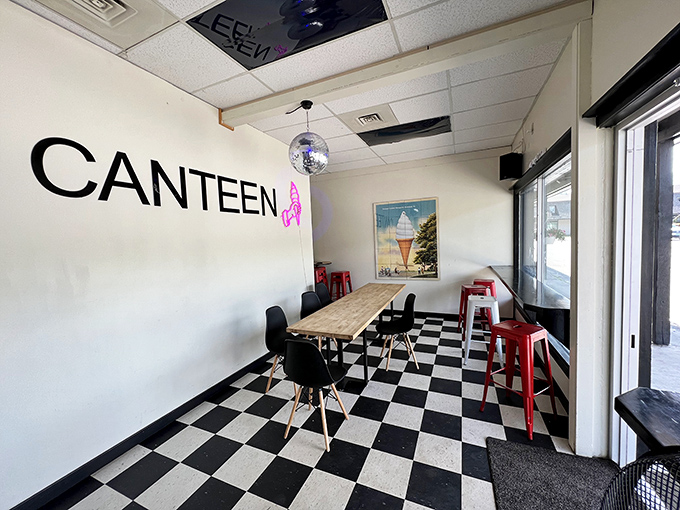 Black and white checkerboard floors, simple tables, and that iconic ice cream wall art create the perfect retro backdrop for memory-making dessert adventures.