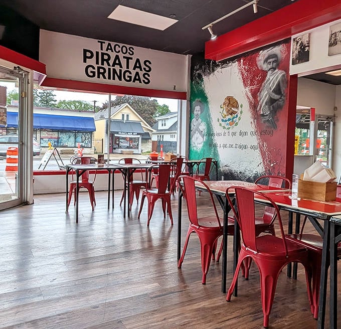 Another interior angle: The bold red-and-white color scheme and revolutionary mural create a dining space that's as vibrant as the food itself.
