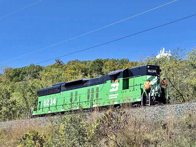 The powerful green locomotive stands ready for departure, its crew ensuring another safe journey through Wisconsin's most picturesque landscapes.