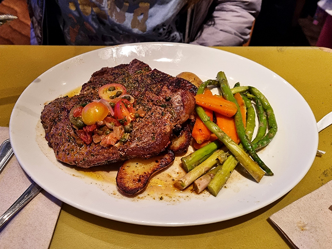 A perfectly seared steak surrounded by vibrant vegetables &ndash; proof that caveman cuisine has evolved into something truly sophisticated.