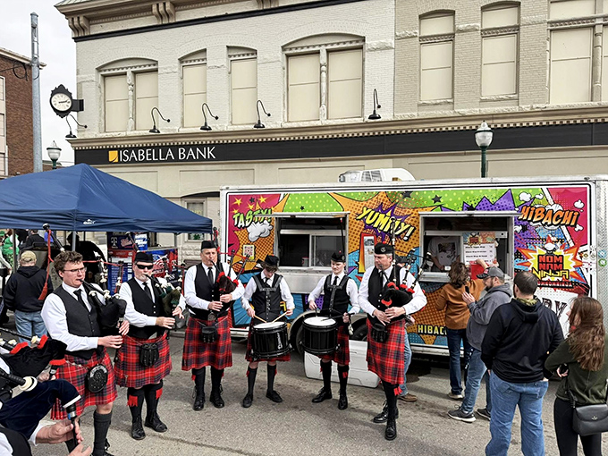 Kilted musicians perform during Clare's Irish Festival, bringing Celtic traditions to life through music that echoes through the downtown streets.