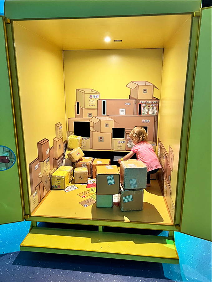 In this cardboard kingdom, future logistics experts arrange and rearrange boxes with the focus of NASA engineers planning a moon landing.
