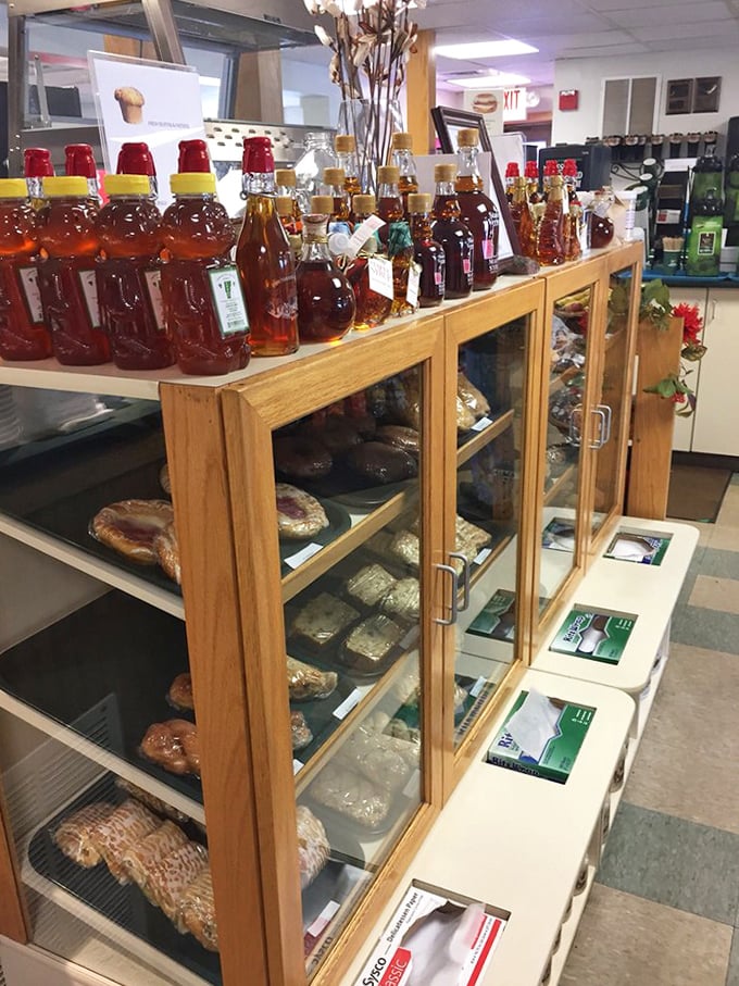 Local maple syrup bottles stand at attention &ndash; liquid gold that transforms ordinary pancakes into a quintessential Vermont experience.