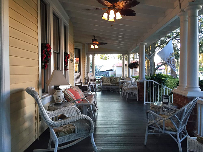 Rocking chairs stand at attention on the wraparound porch, ready for evening conversations and gentle Southern breezes.