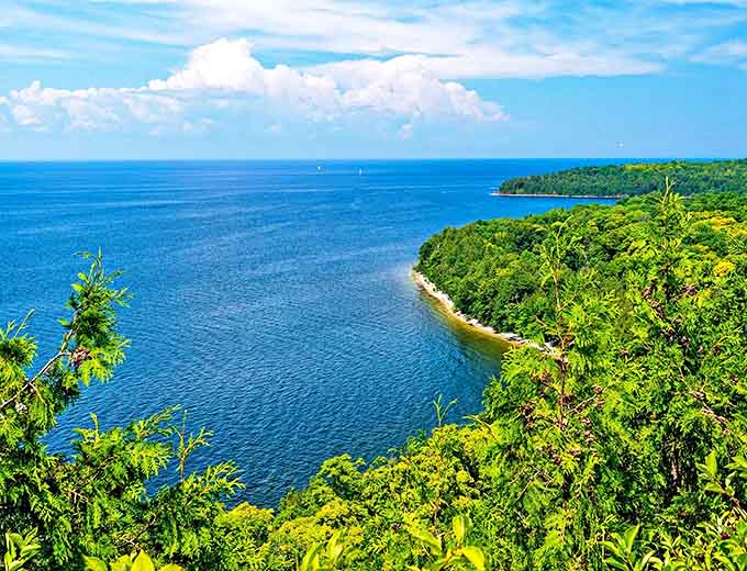 Peninsula State Park showcases Wisconsin's natural splendor, where forest meets shoreline in a perfect Great Lakes embrace.