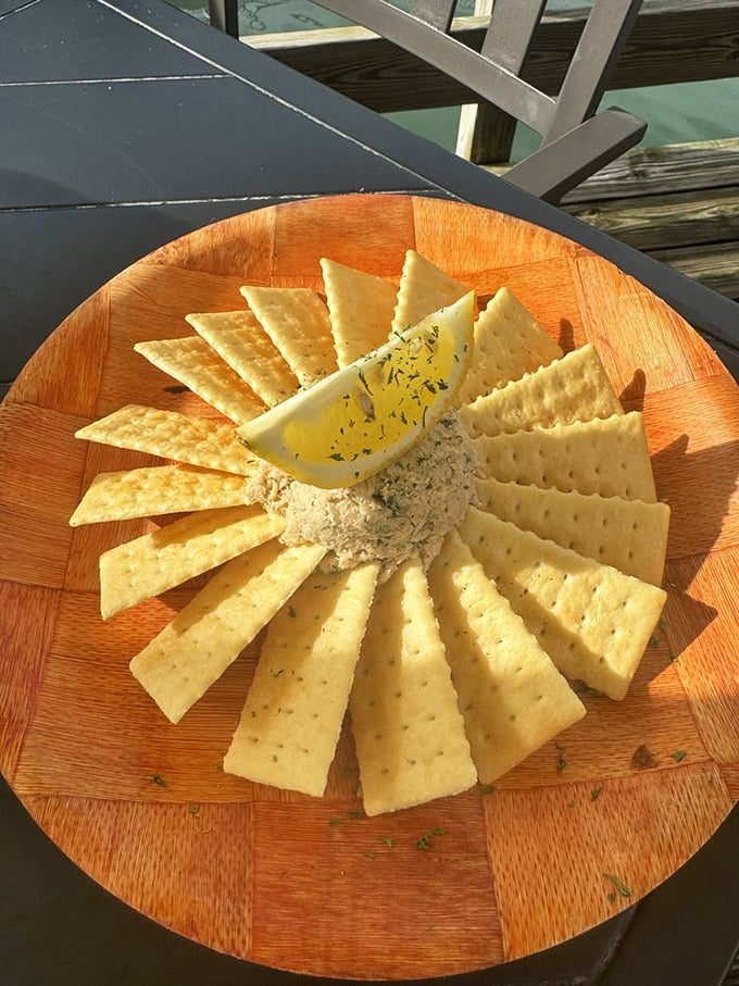 Smoked fish spread arranged like a sunburst with crackers &ndash; Florida's favorite appetizer elevated to art form status.