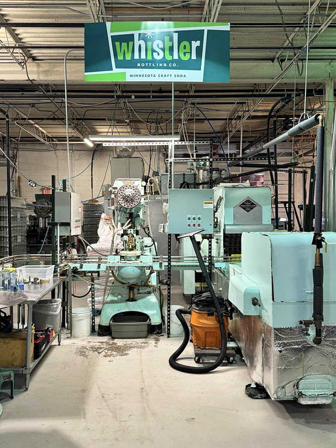 Vintage equipment hums with purpose in the bottling area, a steampunk fantasy where science and sugar create carbonated magic.