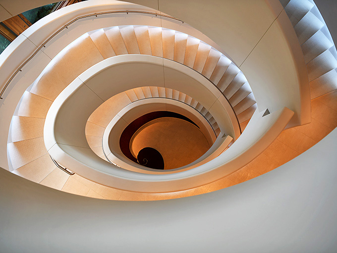 This spiral staircase curves upward with such elegant geometry that it makes you want to climb it just for the experience, even if you're not going anywhere.