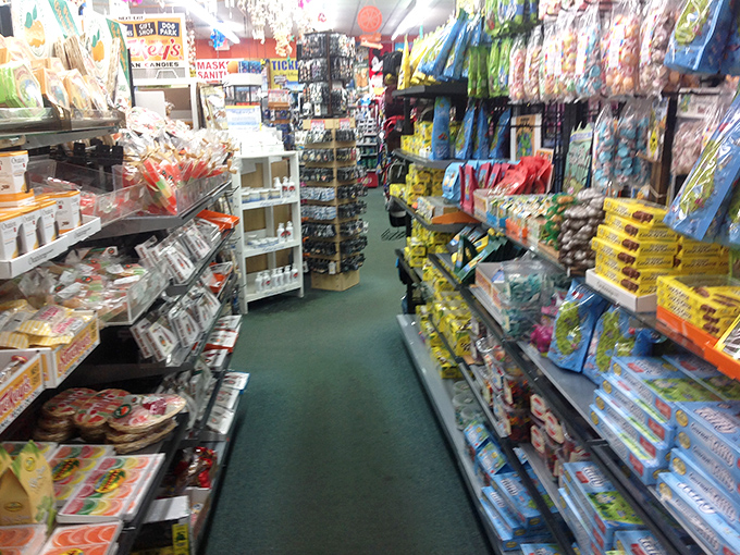 A candy wonderland where diet resolutions go to die amid colorful packaging and childhood nostalgia.