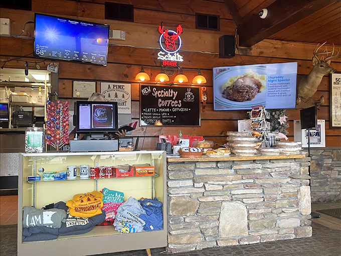 The counter area showcases local souvenirs and treats, proving A-Pine isn't just a restaurant but a community hub and unofficial visitor center.