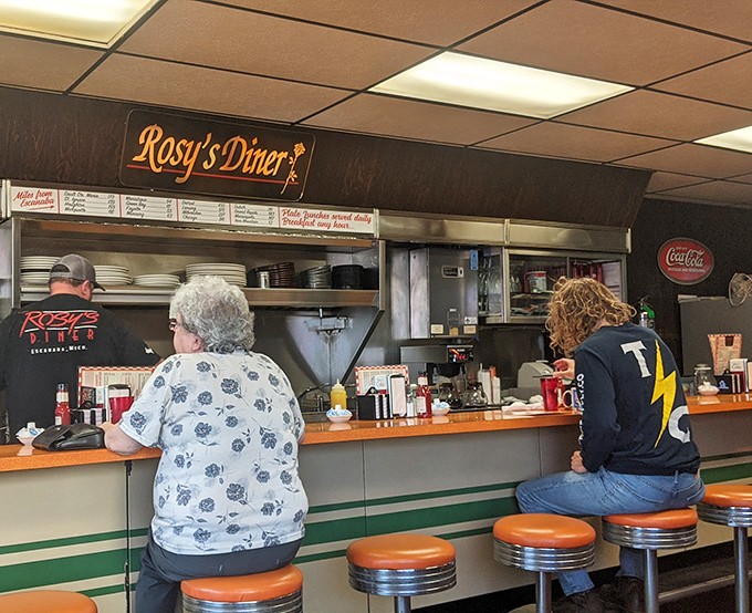 The counter creates a front-row seat to Rosy's morning theater, where regulars and newcomers share stories over steaming cups of coffee.