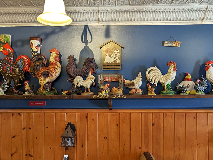 The rooster collection watches over diners like guardians of the chicken realm &ndash; a whimsical touch that adds to the restaurant's unpretentious charm.