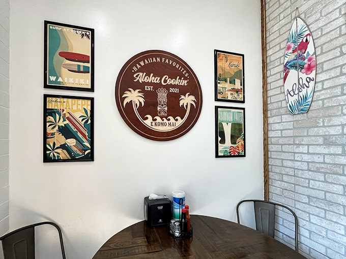 Vintage Hawaiian travel posters and a circular wooden sign create an authentic island atmosphere that transports diners straight to the Pacific.