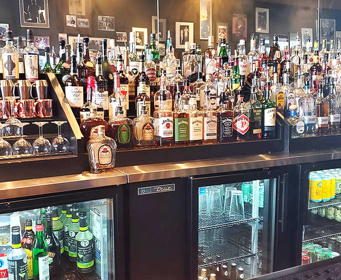 The bar's impressive array stands ready like a liquid library, each bottle promising stories and good times without pretension.