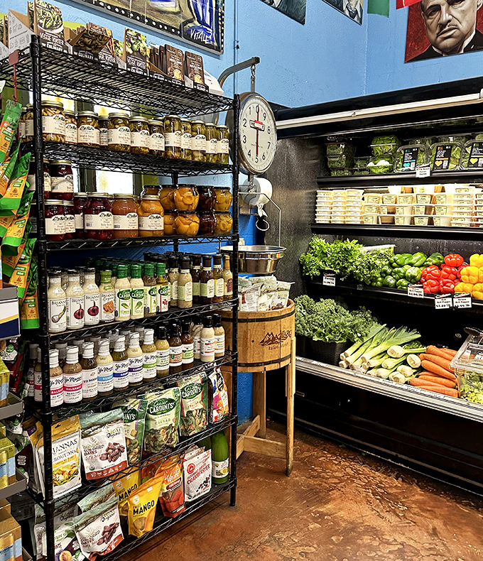 Shelves stocked with bottled miracles and fresh produce. That Godfather portrait watching over the olive oils is no coincidence, folks.