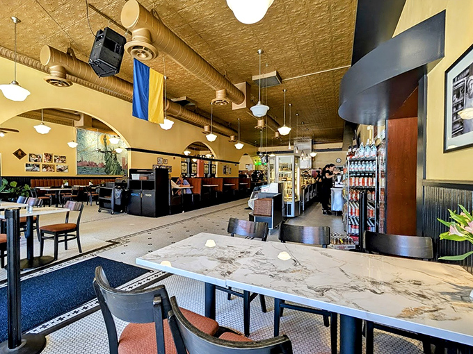 Cozy corner seating invites you to linger over your feast. The pressed tin ceiling and warm lighting create the perfect backdrop for serious eating and casual conversation.